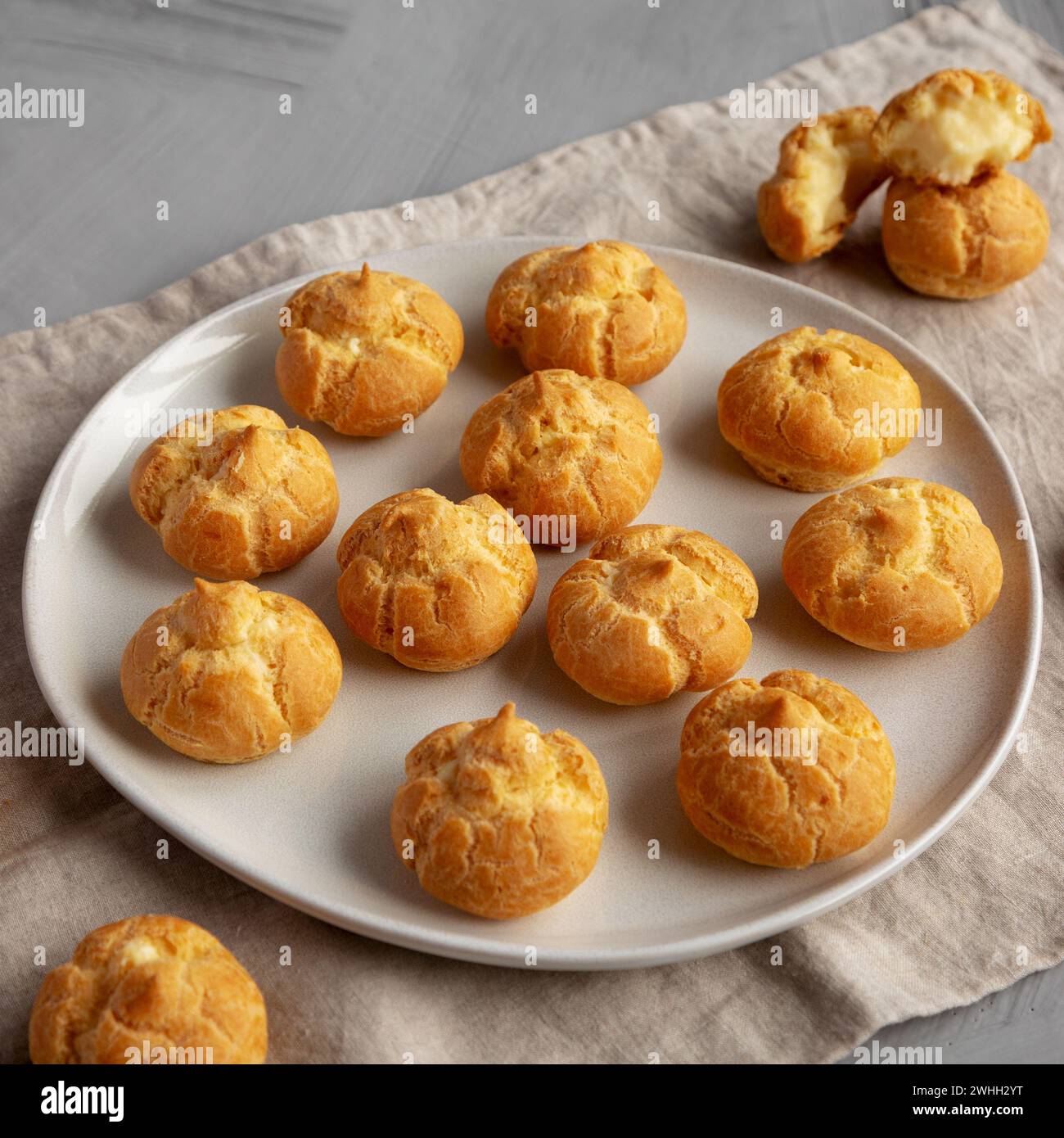 Homemade Mini Cream Puffs on a Plate, side view Stock Photo - Alamy