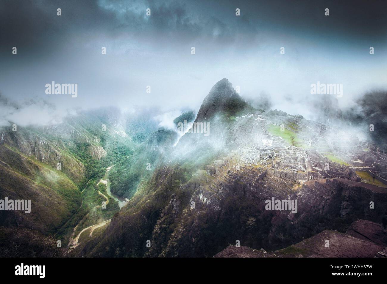 The ancient Incan ruins of Machu Picchu, Peru emerge from morning ...