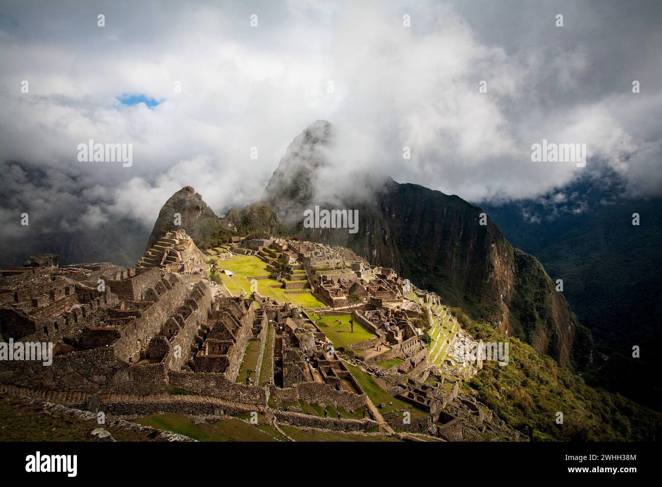 The once lost city of Machu Picchu emerges from the clouds in the ...