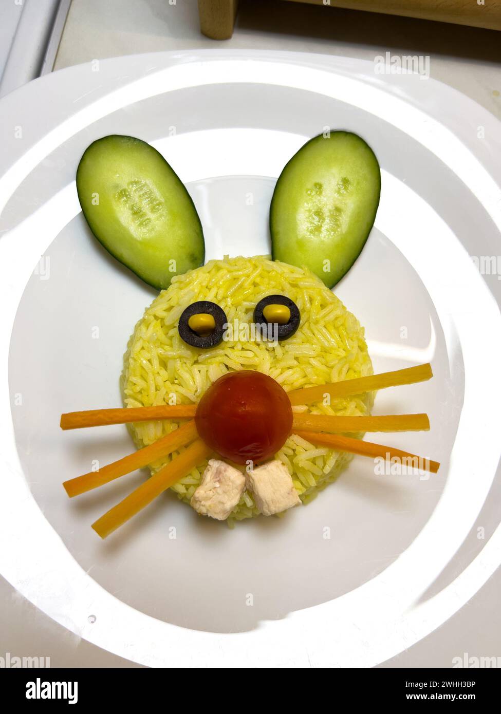 Rice with vegetables in the shape of a rabbit head Stock Photo - Alamy