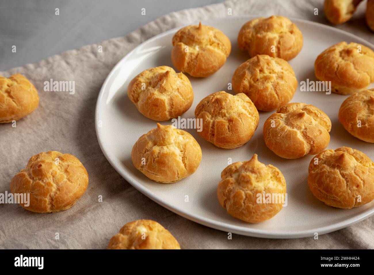 Homemade Mini Cream Puffs on a Plate, side view Stock Photo - Alamy