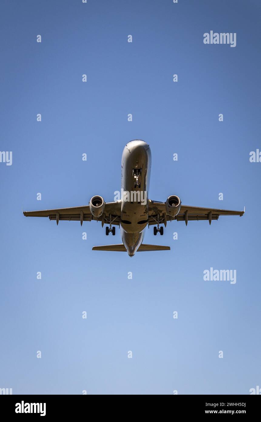 The belly of a jet plane flying low in Arlington, Virginia Stock Photo ...