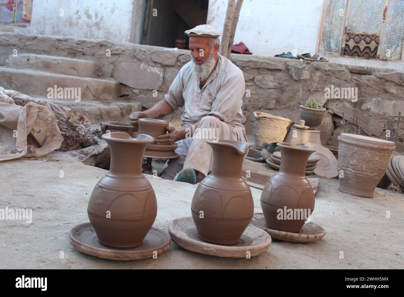 Laghman, Afghanistan. 10th Feb, 2024. An Afghan worker makes pots at a ...