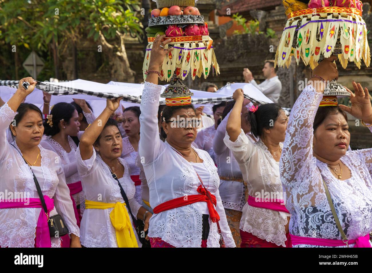 People in traditional clothes on the streets of Ubud, Bali Stock Photo ...