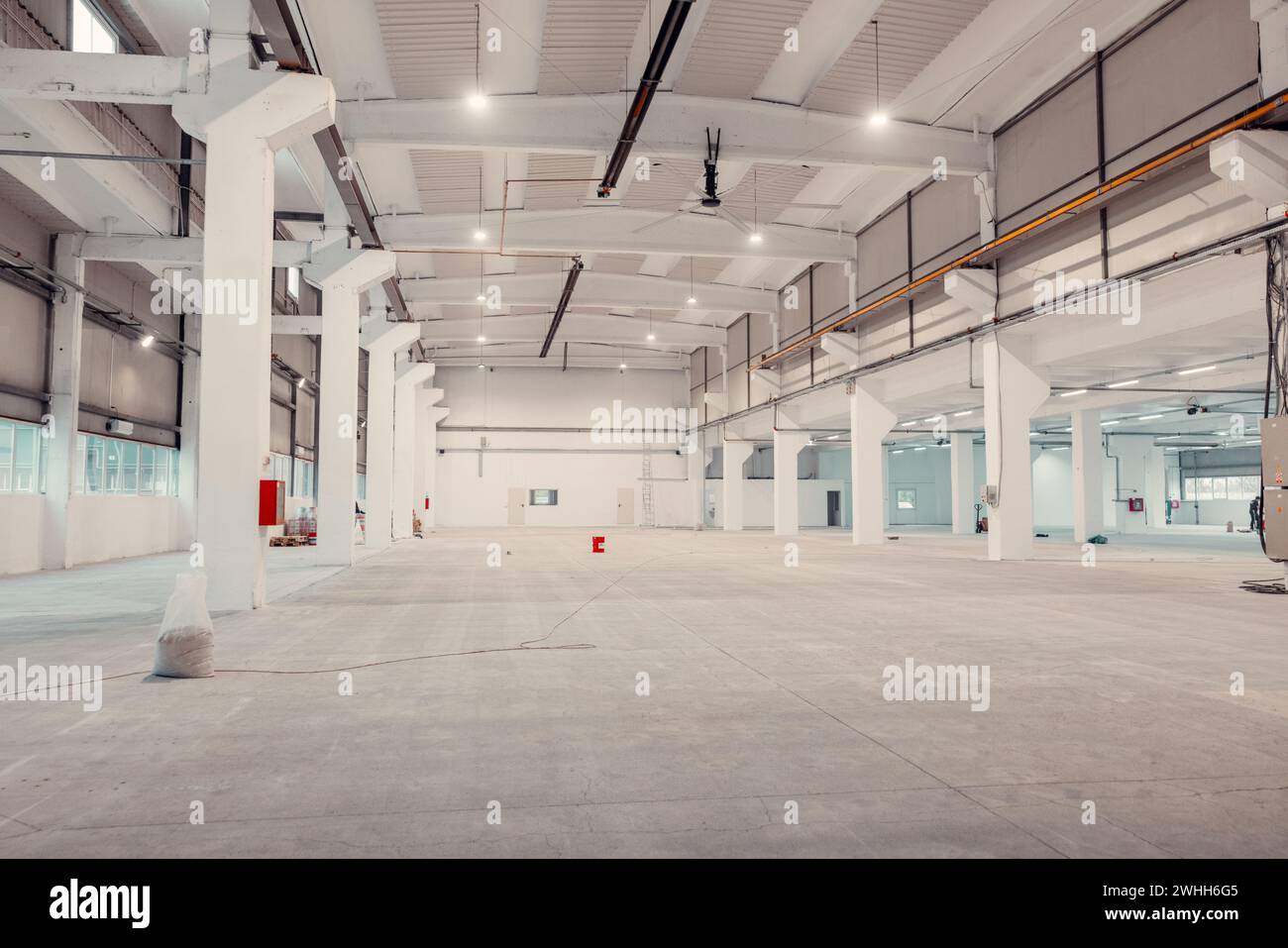 Empty moderna and spacious warehouse currently under work Stock Photo ...