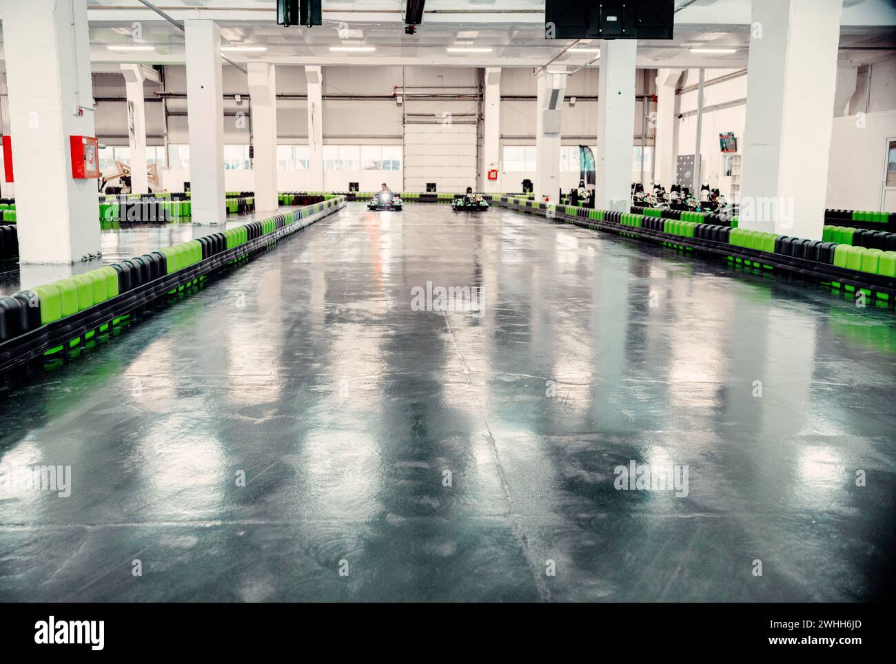 Inside a kart track two drivers race to the finish line Stock Photo - Alamy