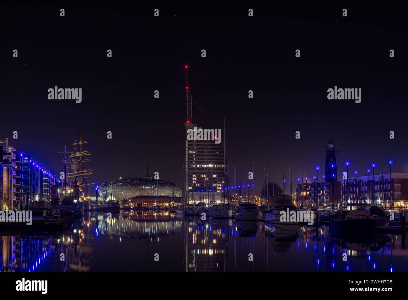 Modern waterfront buildings illuminated on a winter night in ...