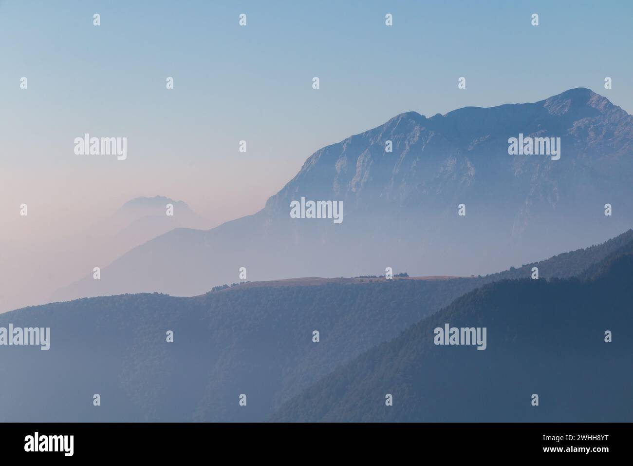 Spectacular mountain ranges silhouettes in morning Stock Photo - Alamy