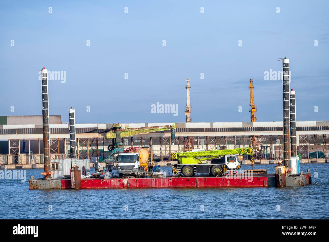 Floating platform with crane for hydrotechnical works and concrete ...