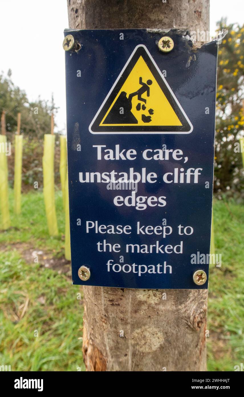 Sign warning of unstable cliff edges, keep to marked footpaths. On the ...