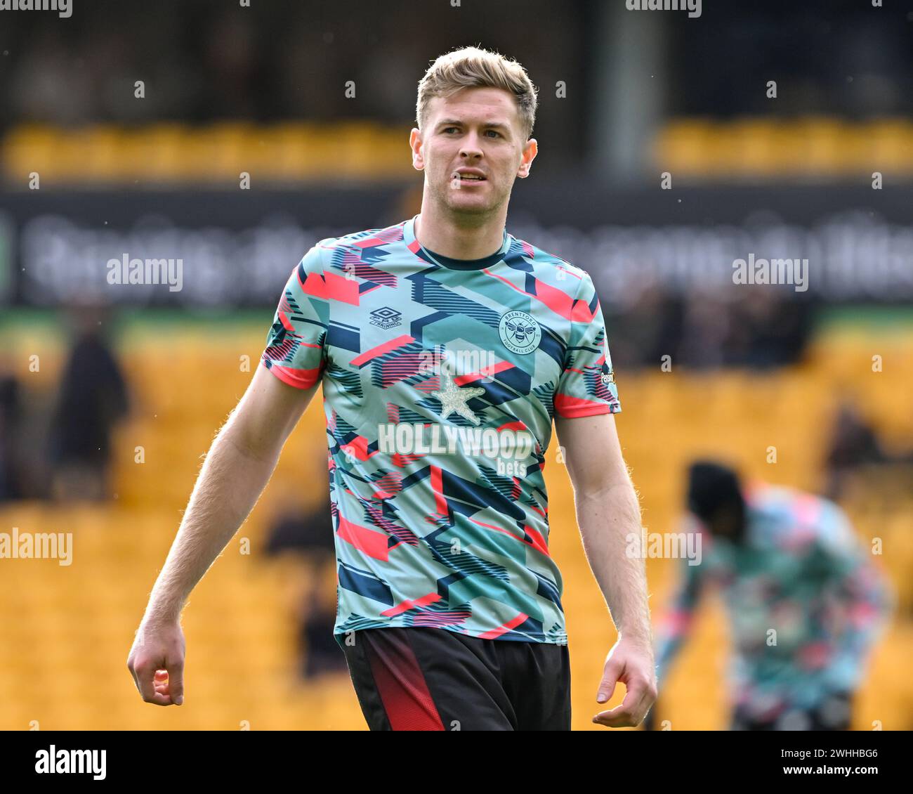 Nathan Collins of Brentford warms up ahead of the match, during the ...