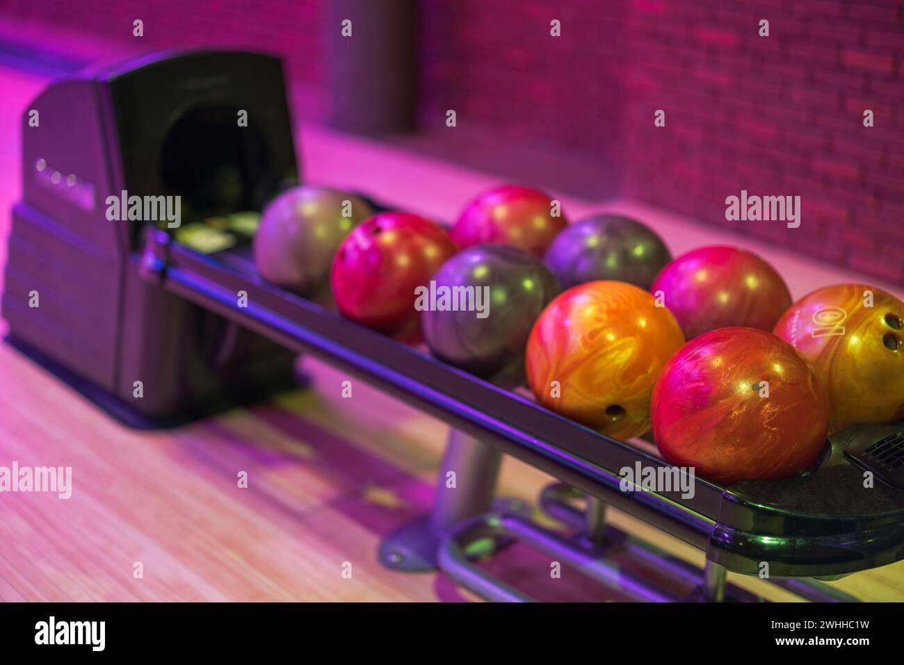 View of automated ball rack system in bowling center, ensuring smooth ...