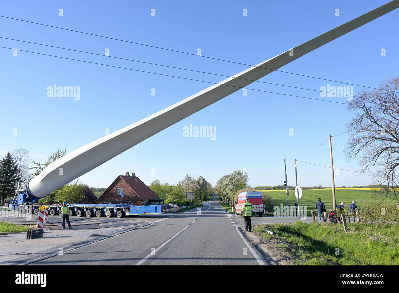 Heavy duty transport of a windmill blade lifted up to avoid obstacles ...