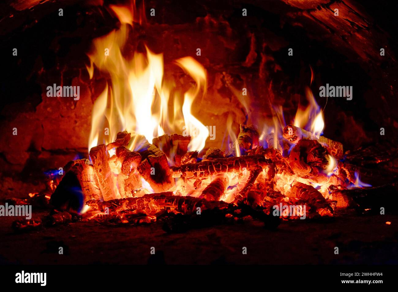 Bright flames rise energetically from burning wood logs Stock Photo - Alamy