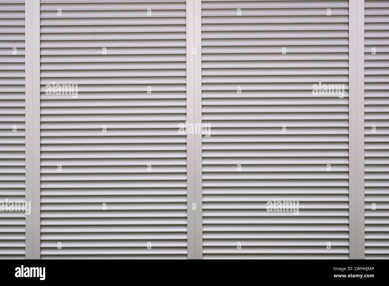 Facade with closed roller shutter Stock Photo - Alamy