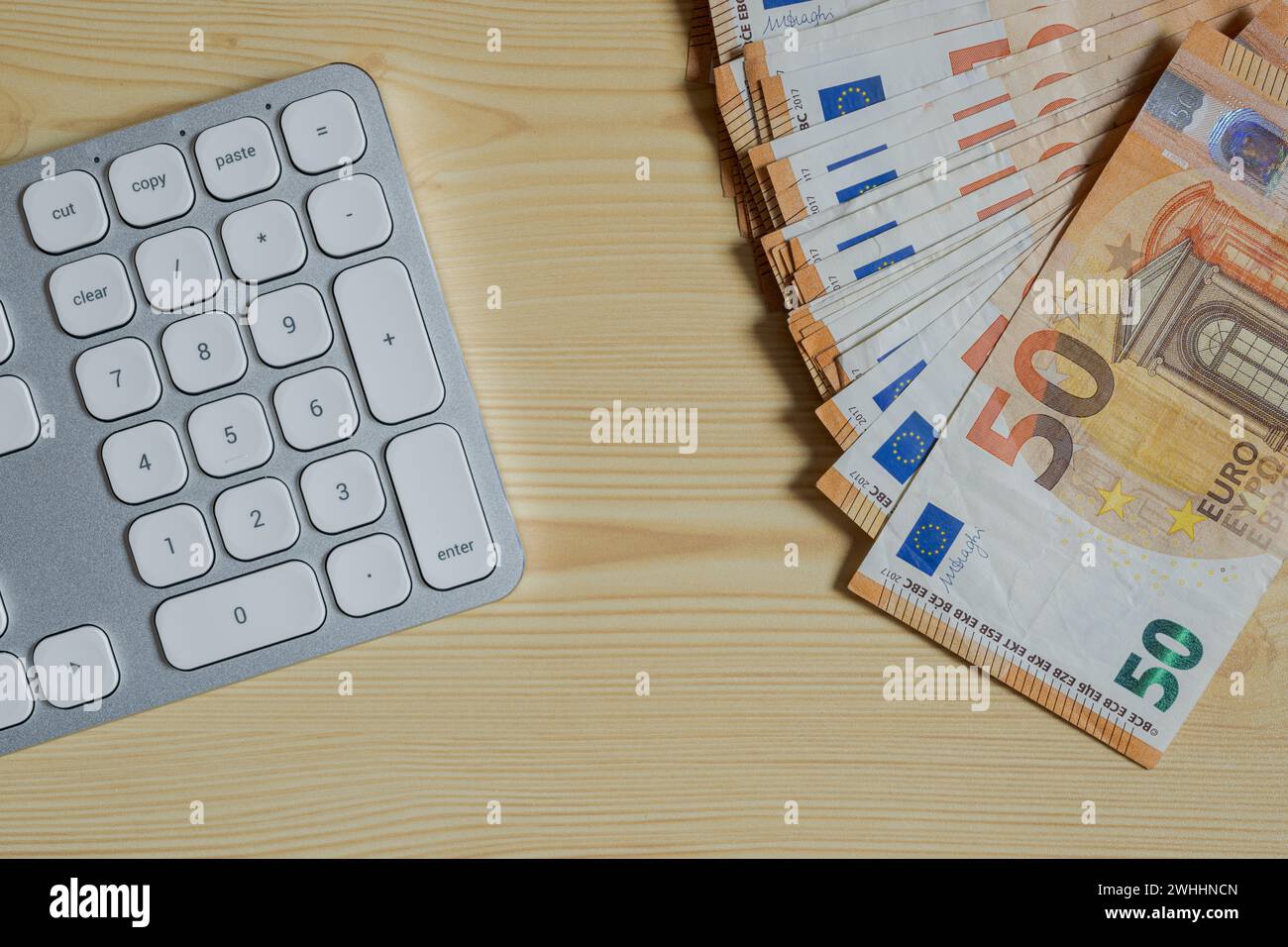 Desktop PC computer keyboard and European Union Euro currency banknotes ...
