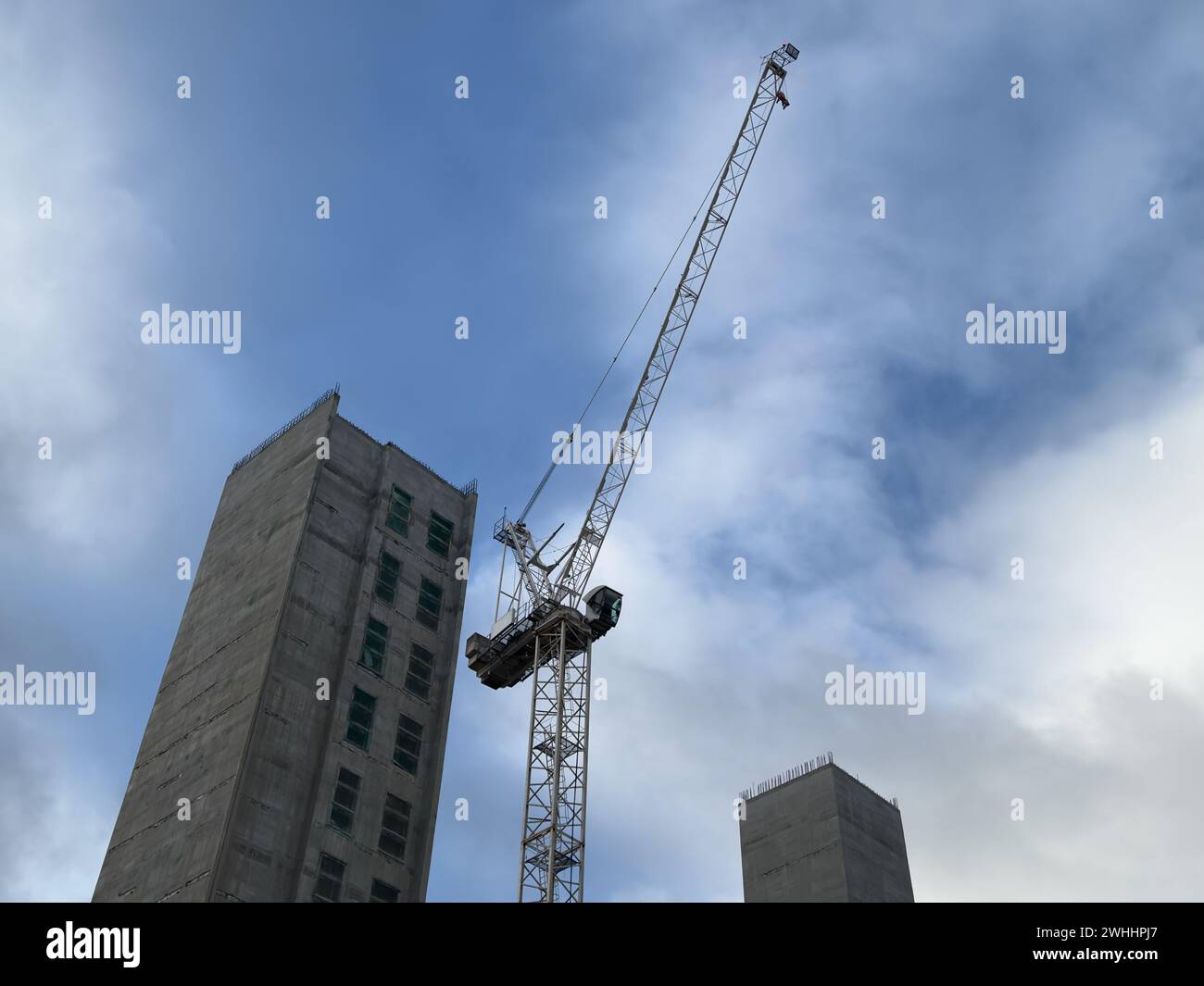 Tower cranes at new high rise apartment development during construction ...