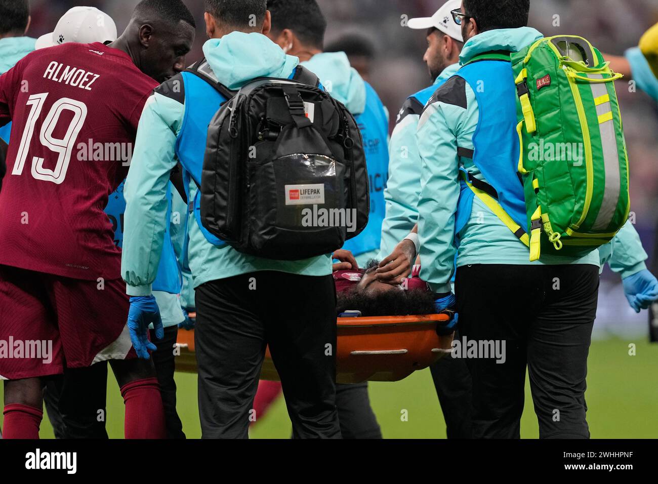 Qatar's Akram Afif is carried away on a stretcher after an injury ...