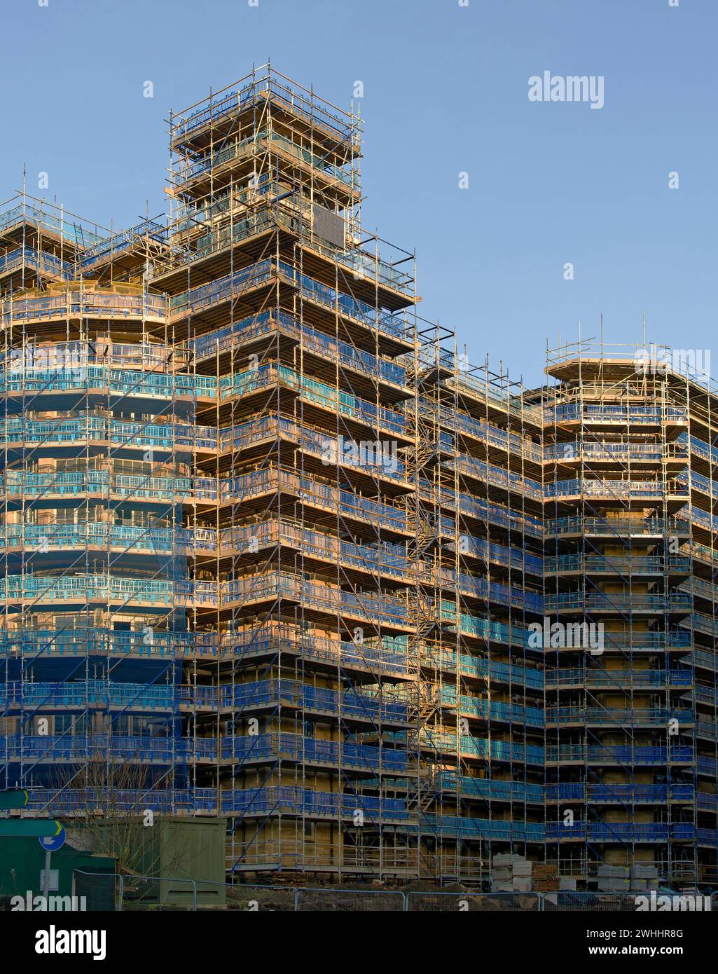 Scaffolding surrounding residential development for safe access to ...