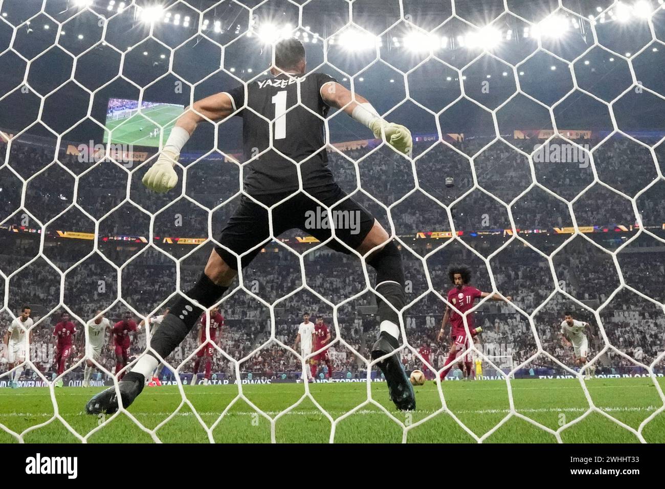 Qatar's Akram Afif scores his side's opening goal from a penalty during ...