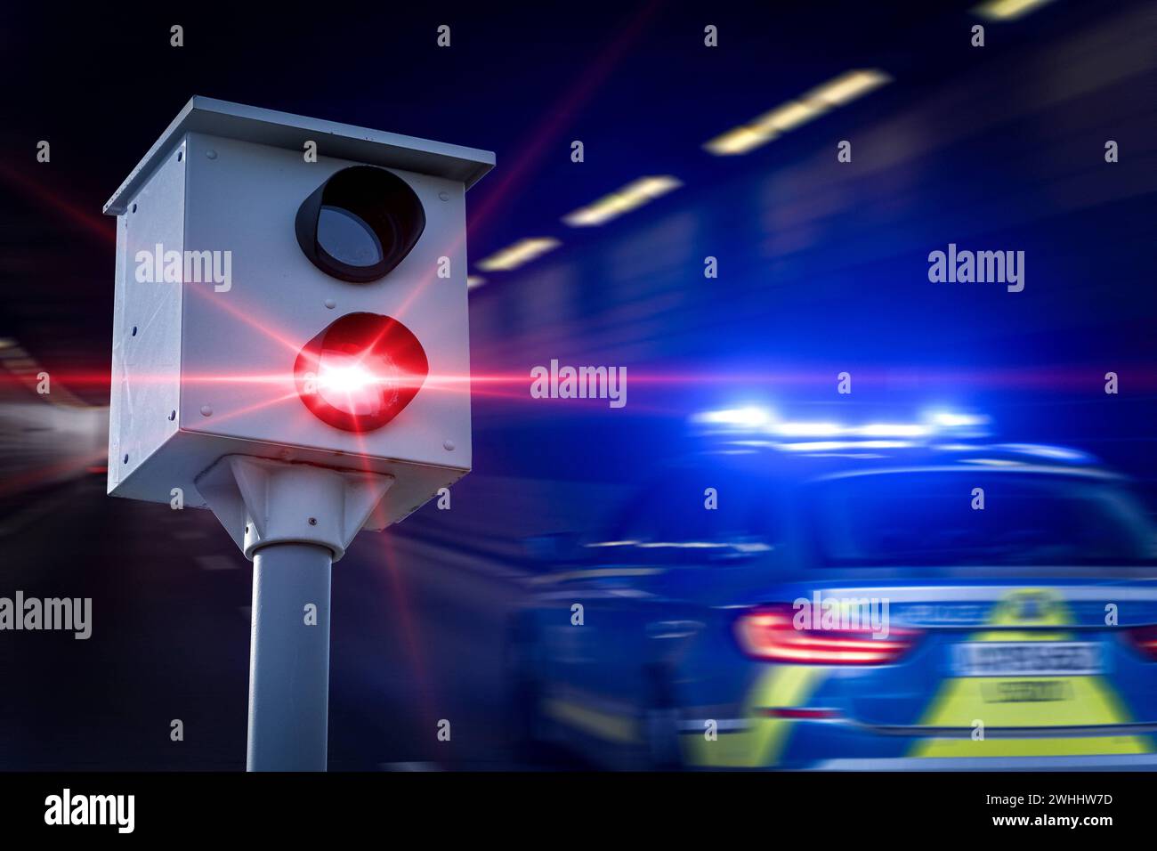 10 February 2024: Speed trap with red flashing light next to a police ...
