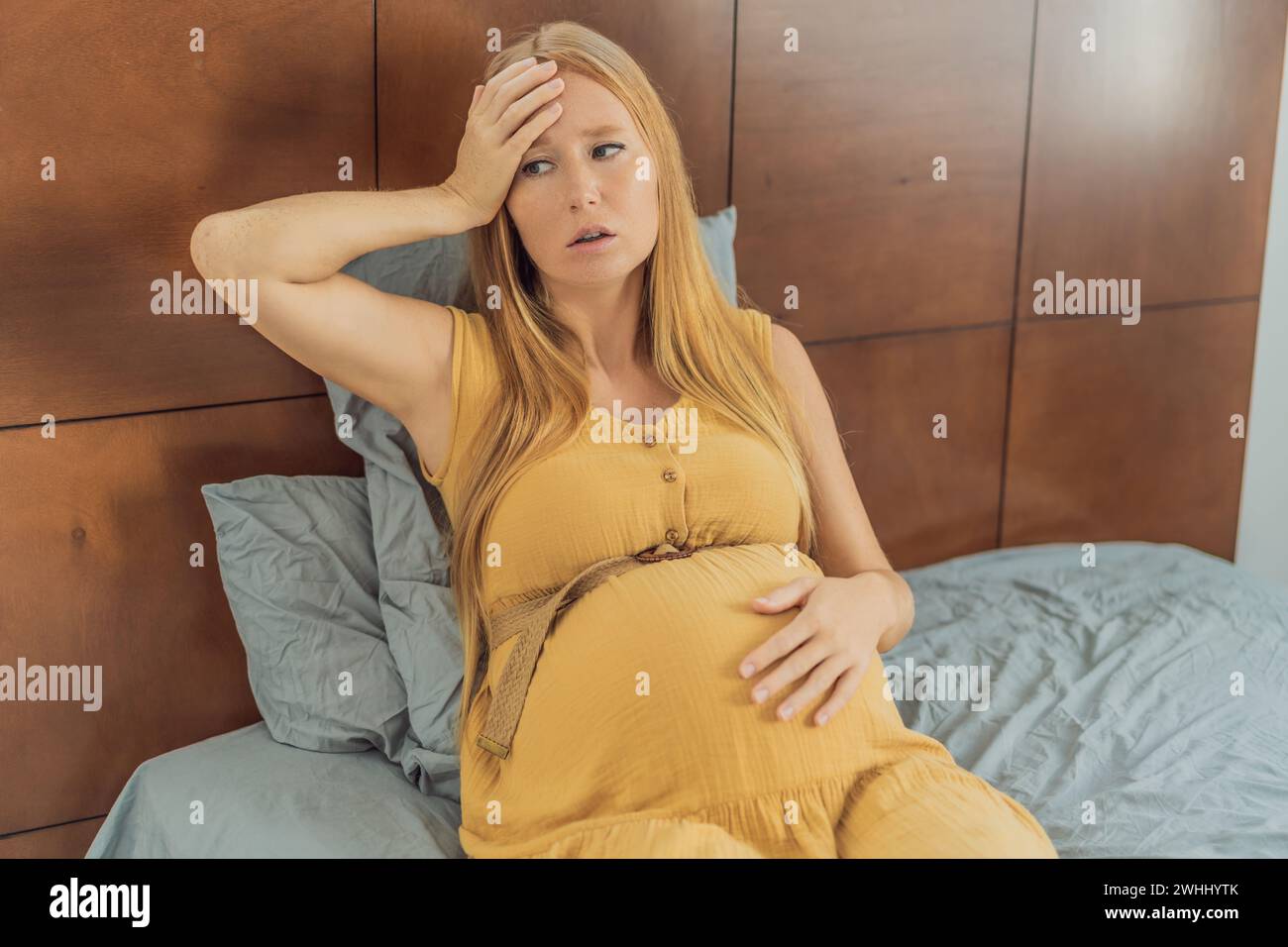 Expectant woman experiences discomfort, feeling unwell during pregnancy ...