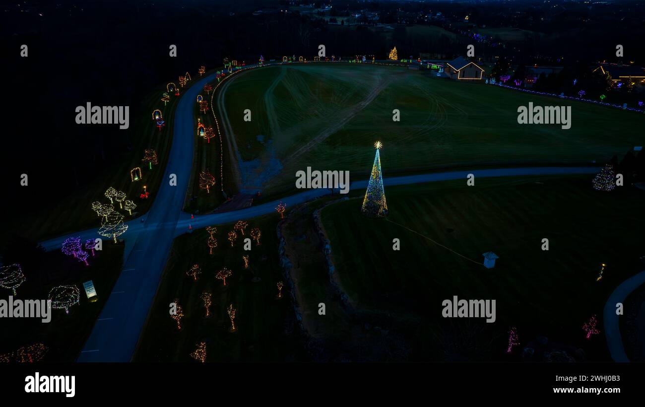 Aerial Nighttime View Of A Large Lit Christmas Tree And Multiple ...