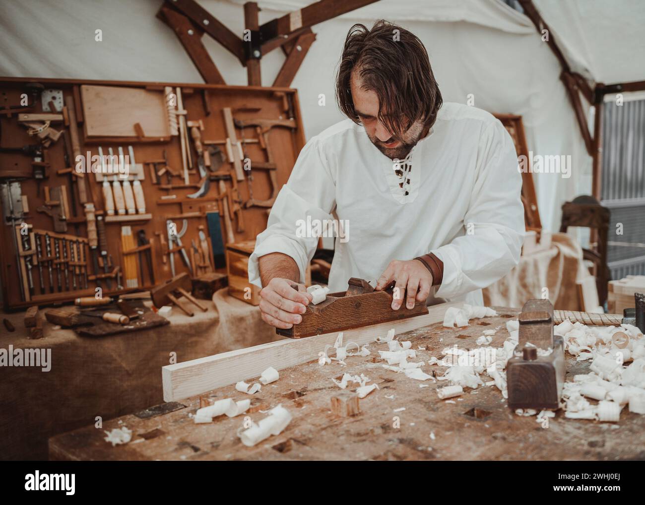 wood craftsman working in a mediterranean workshop; photographed during ...