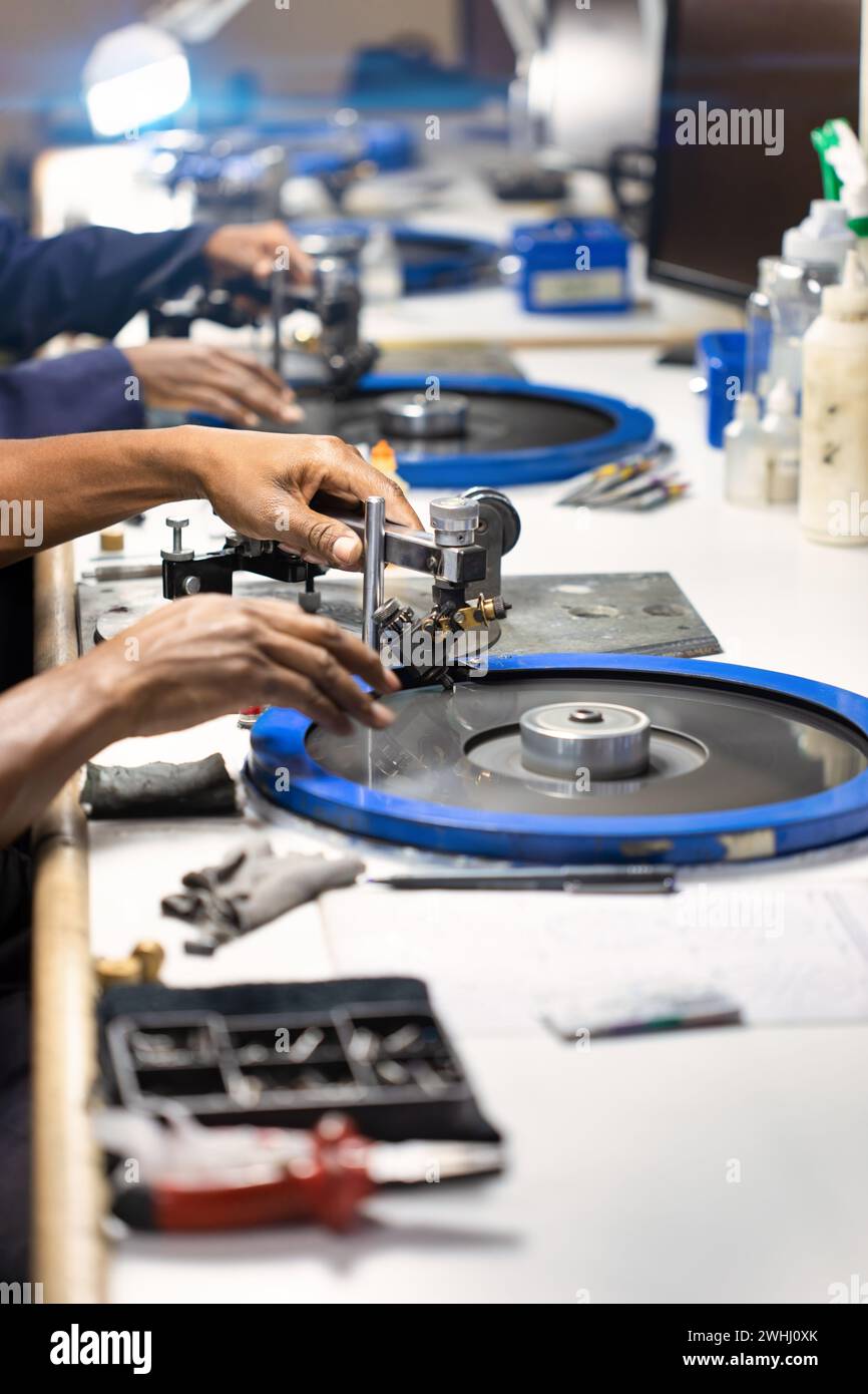 diamond polishers at work at the wheel in the diamond polishing factory ...