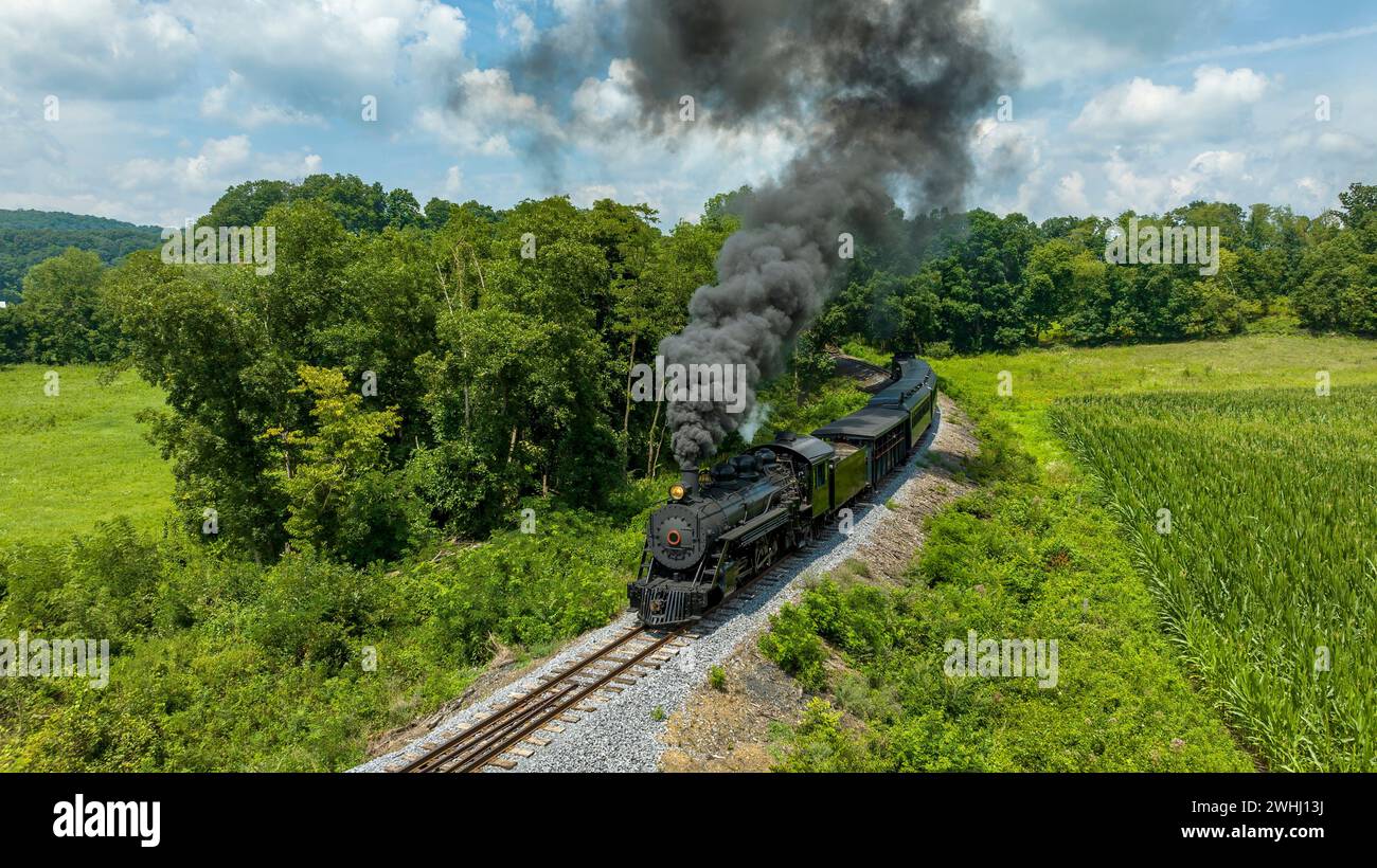 An Aerial View of a Classic Black Narrow Gauge Steam Train Chugging ...