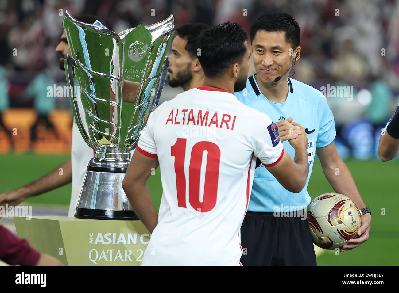 Lusail, Qatar. 10th Feb, 2024. Referee Ma Ning (R) shakes hand with Mousa Altamari of Jordan ...