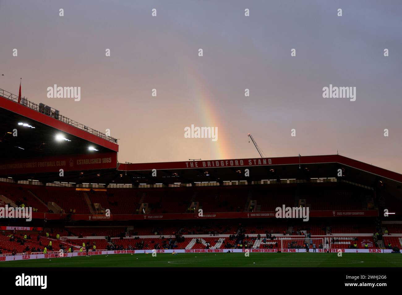 A rainbow forms in the sky above the ground before the Premier League ...
