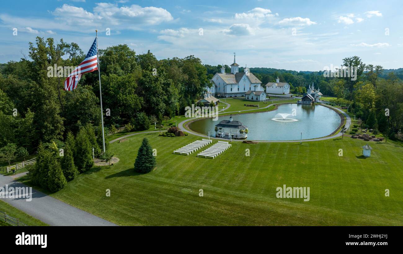 Aerial View Of A Grand White Building With A Grey Roof Surrounded By ...