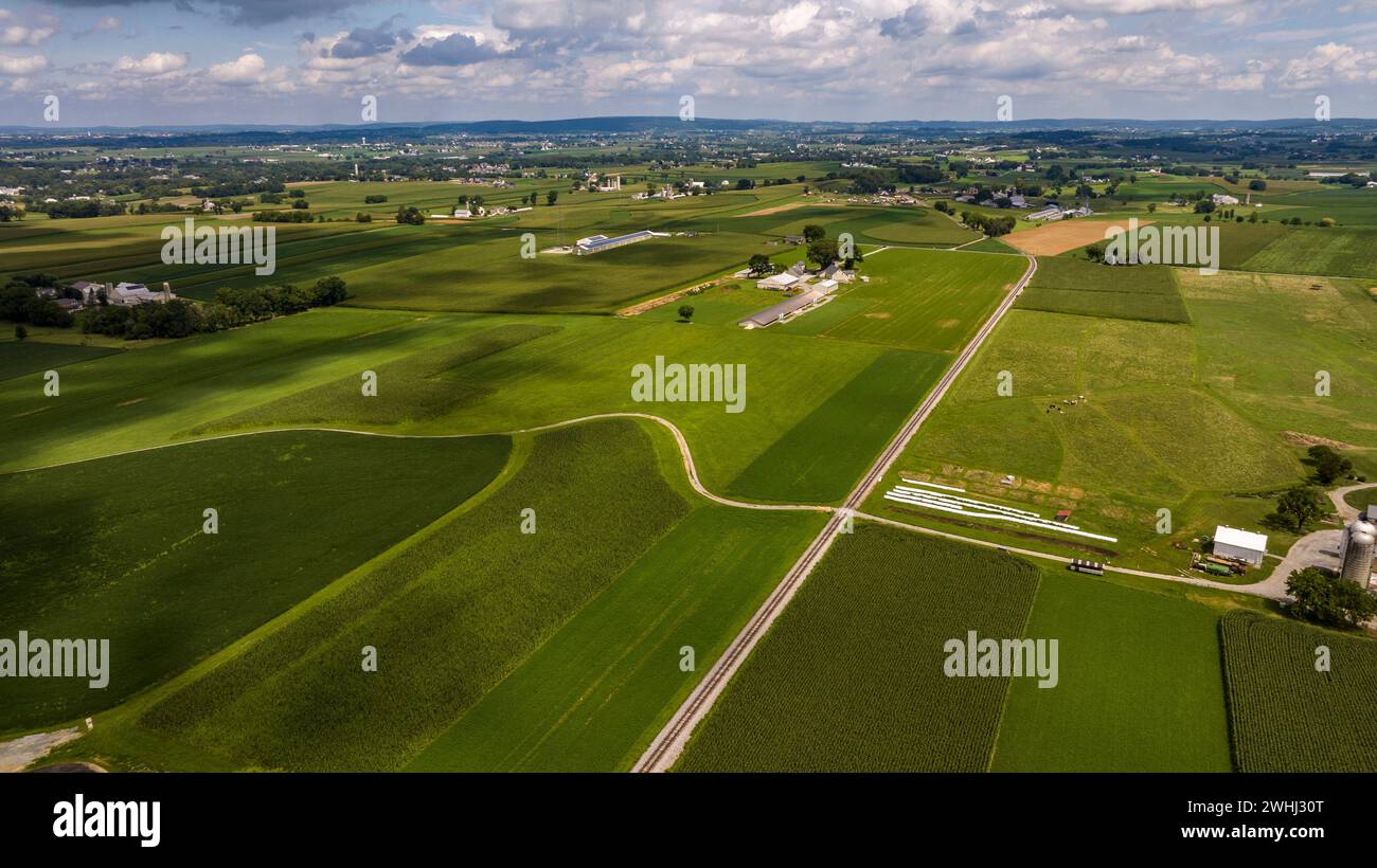 Expansive Aerial View Of Rolling Green Agricultural Fields, Farm ...