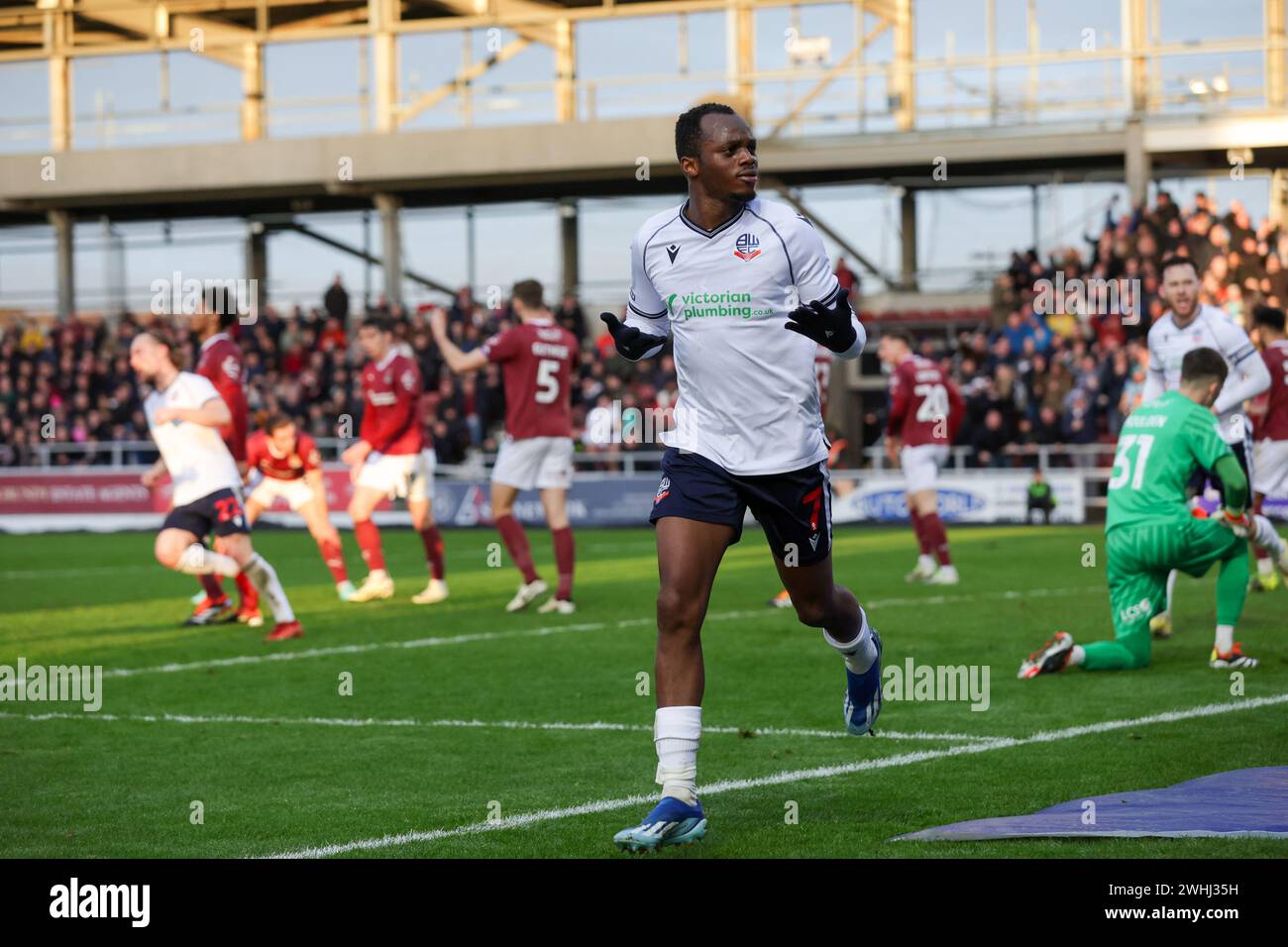 Carlos Mendes Gomes celebrates after scoring for Bolton Wanderers, and ...