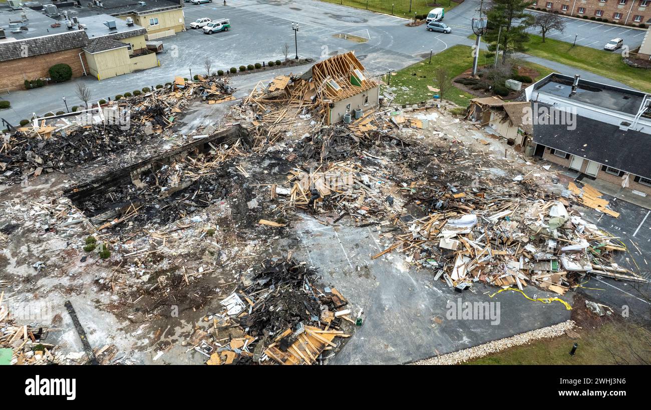 An Aerial View Of A Devastated Building Amidst Intact Structures With ...