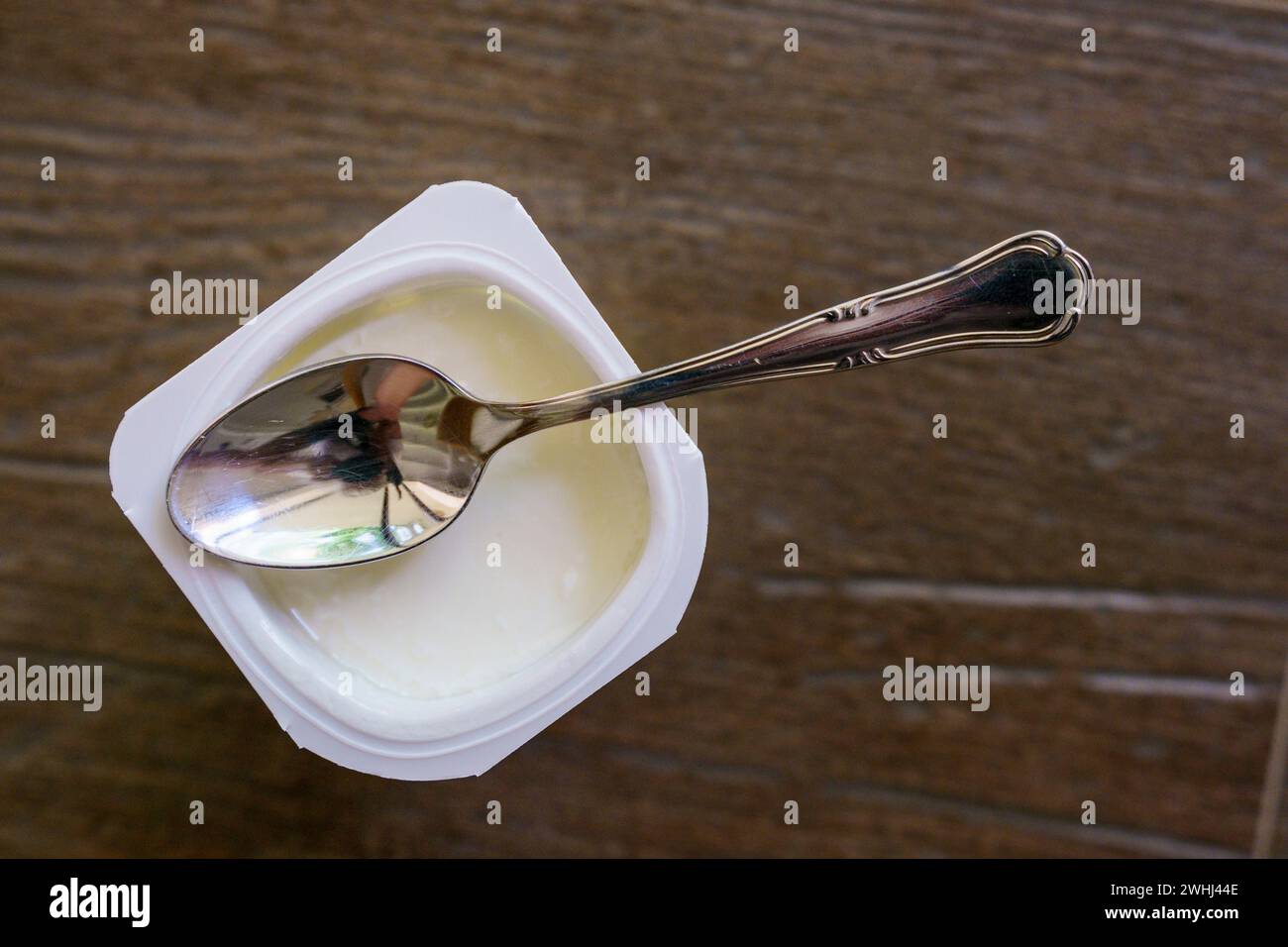 Natural yogurt and teaspoon Stock Photo - Alamy