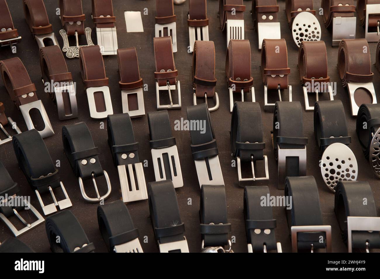 various belt buckles positioned against skin belted Stock Photo - Alamy