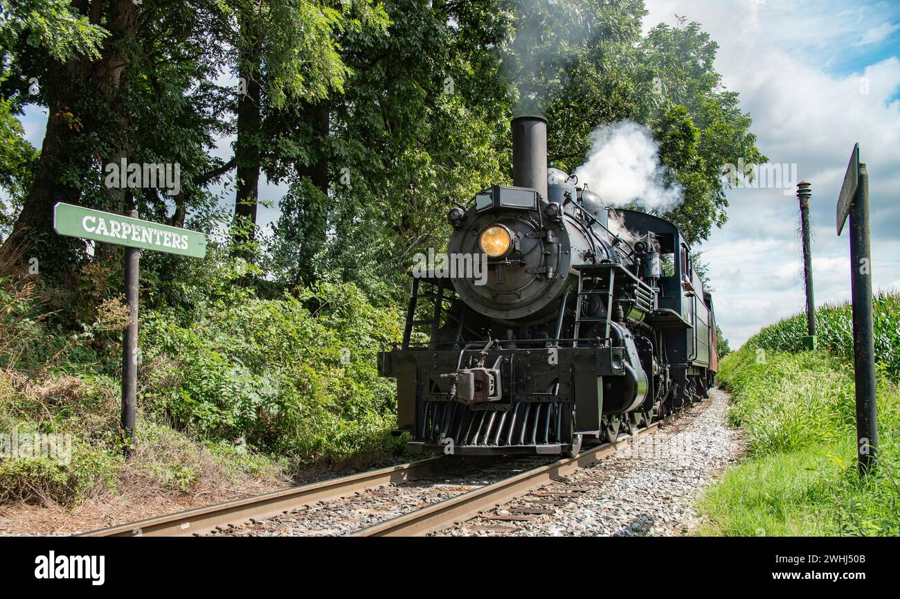 Historic Number 89 Steam Train Approaching 'Carpenters' Station Amid Lush Trees On A Clear Day ...