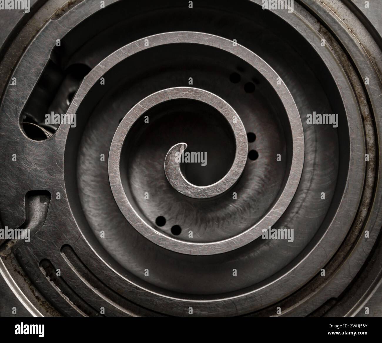 Metal spiral part of the mechanism close up Stock Photo - Alamy