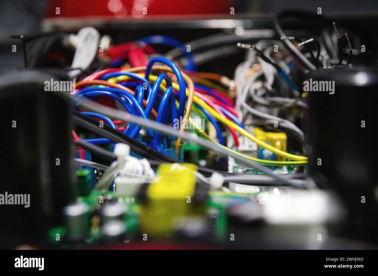 Computer electrical board with connected wires close up Stock Photo - Alamy