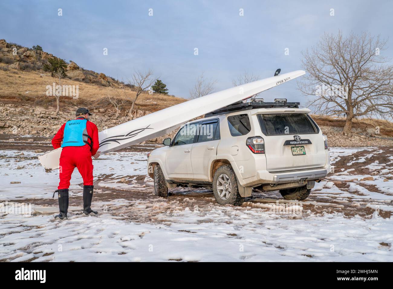 Loveland, CO, USA - February 6, 2024: Senior rower is loading Liteboat ...