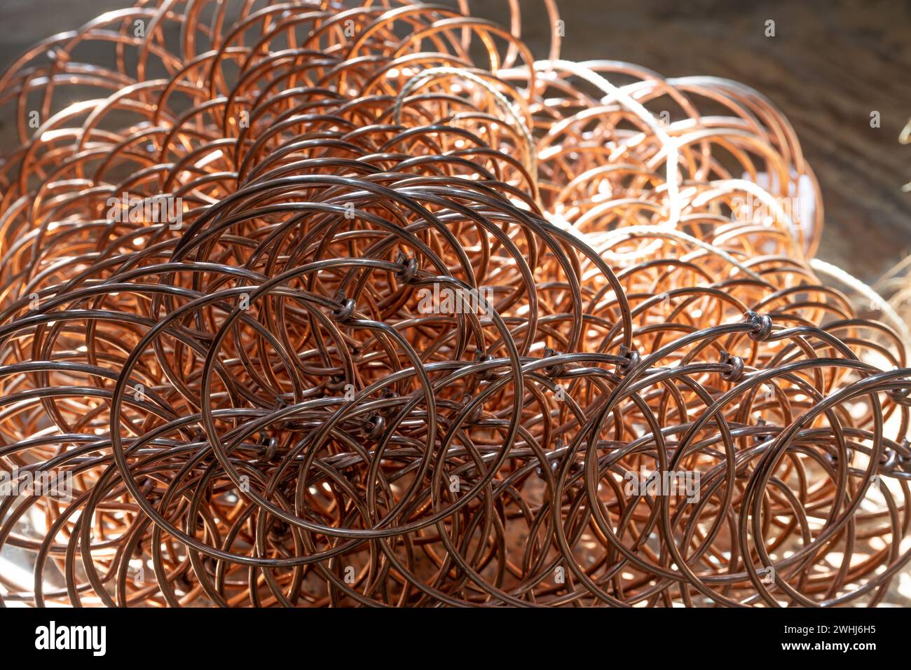 Copper wire springs for furniture seats and mattresses in an upholstery ...