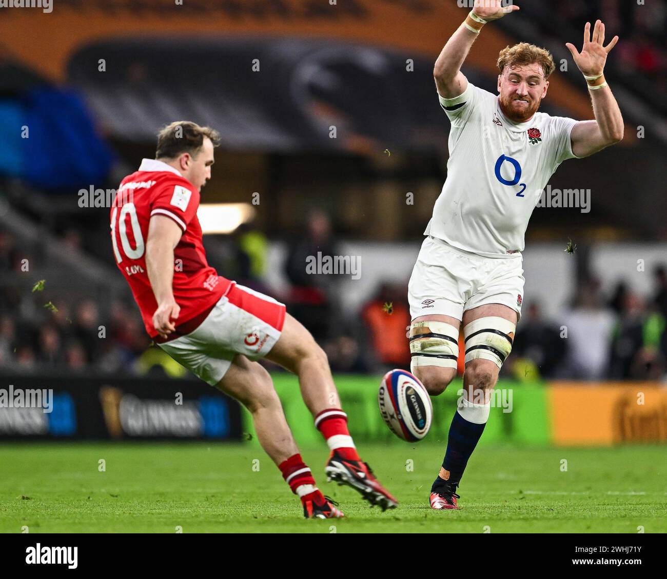 Ollie Chessum of England tries to charge down Ioan Lloyd of Wales kick ...