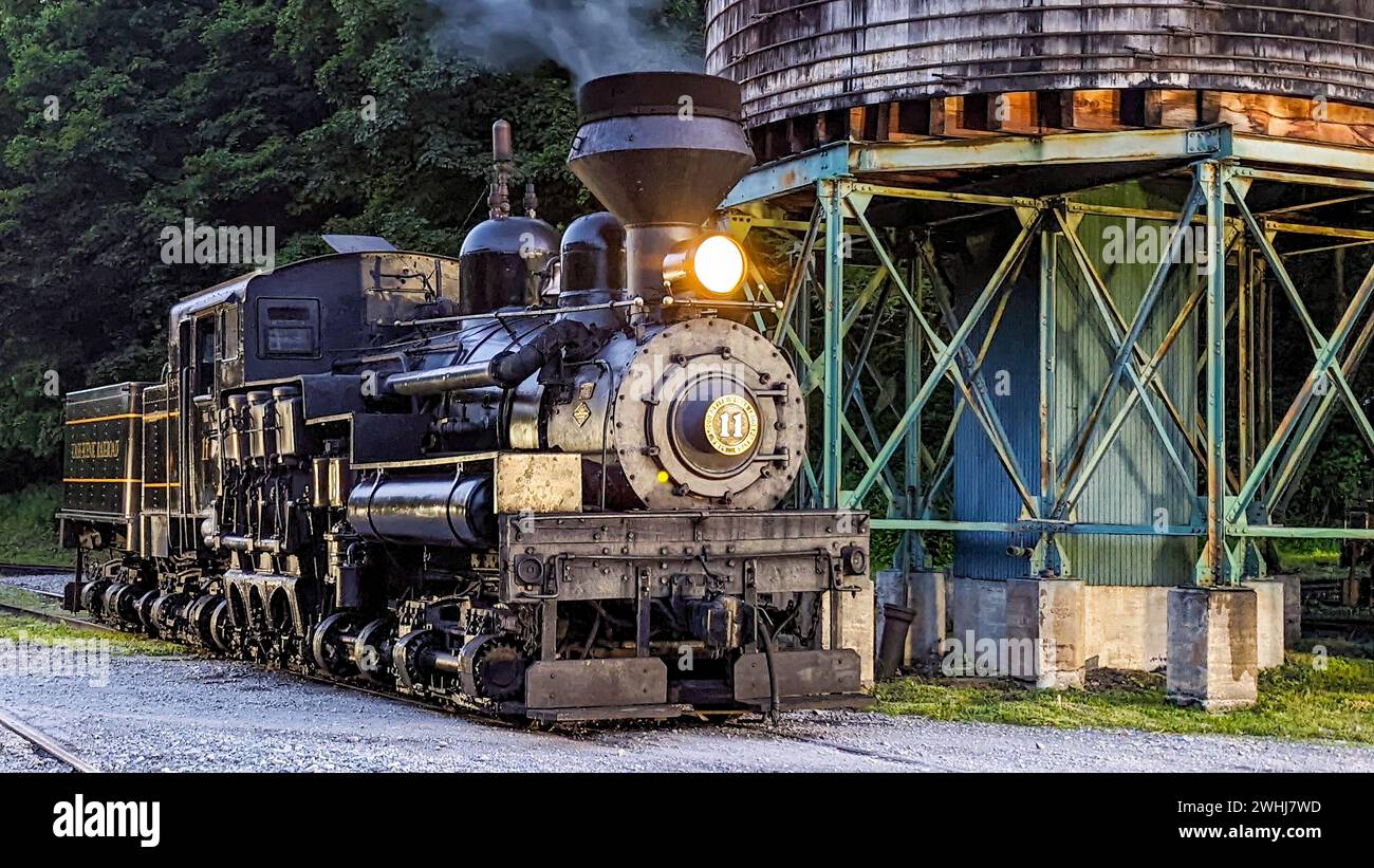 View of an Antique Shay Steam Engine Warming Up by an Old Water Tower ...