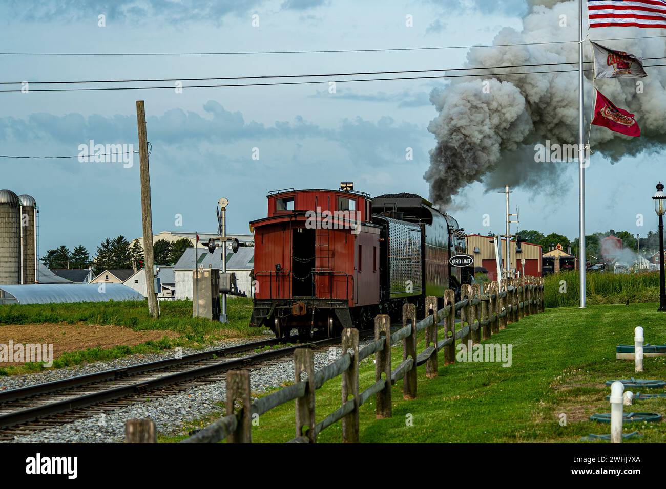 View From the Rear of a Modern Steam Locomotive and Caboose Blowing ...