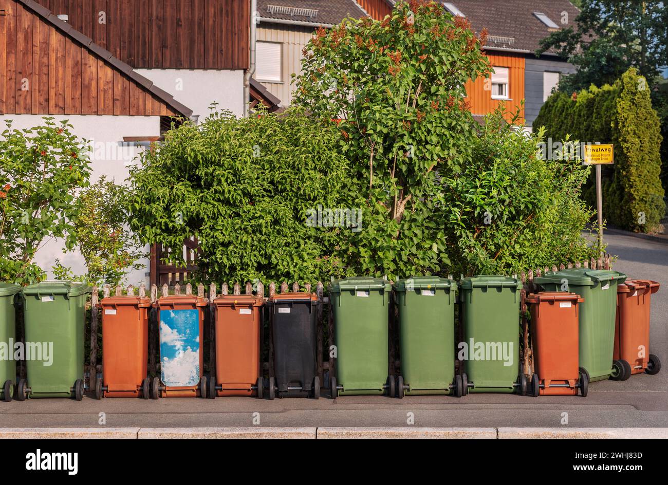 Meeting of waste containers Stock Photo - Alamy