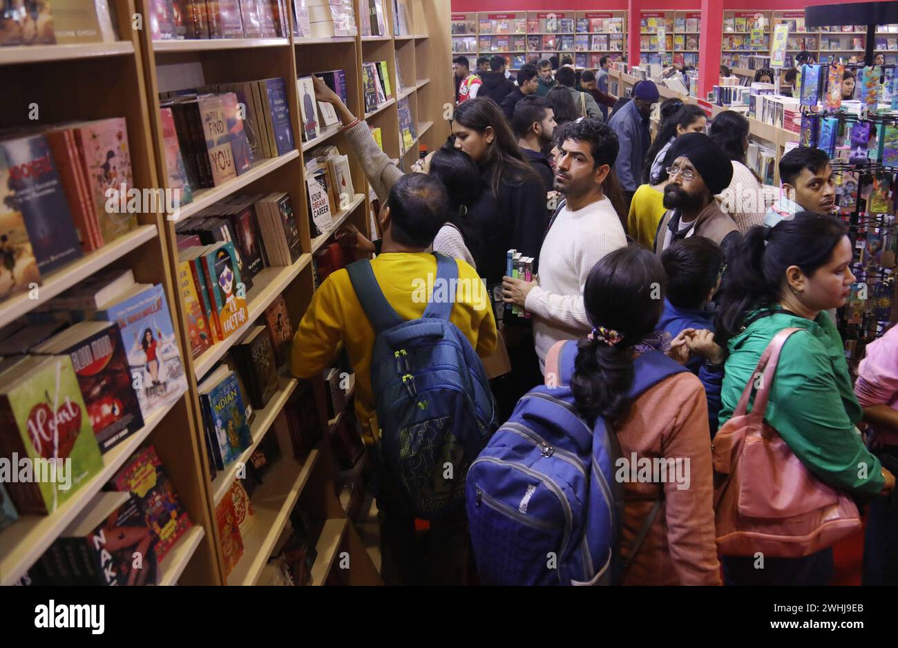 New Delhi, India. 10th Feb, 2024. People visit the book stalls on the ...