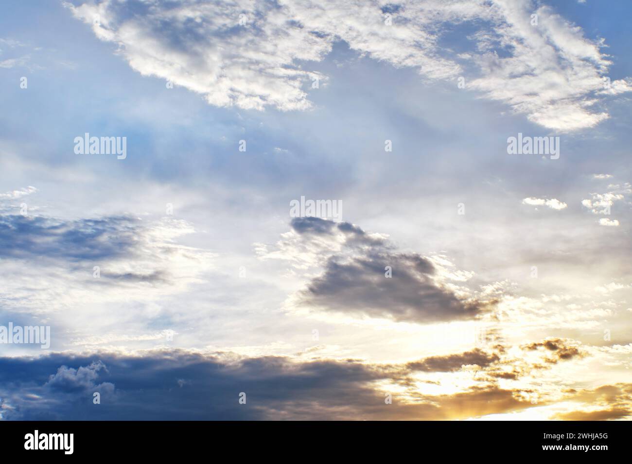 Sunset clouds with sun setting down. Beautiful evening sky with clouds ...