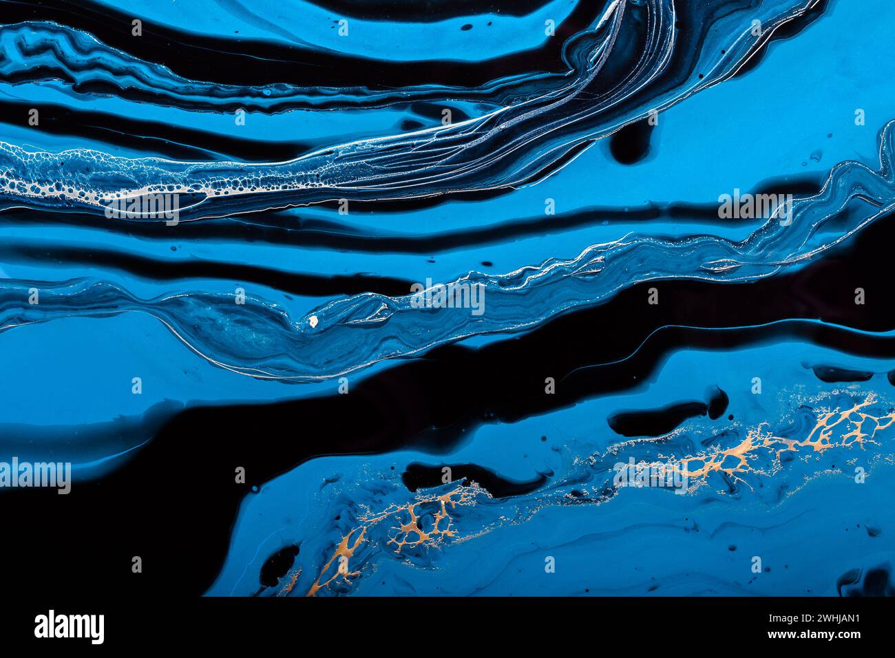 Fluid Art. Golden wave in abstract ocean of blue paint. Marble effect ...